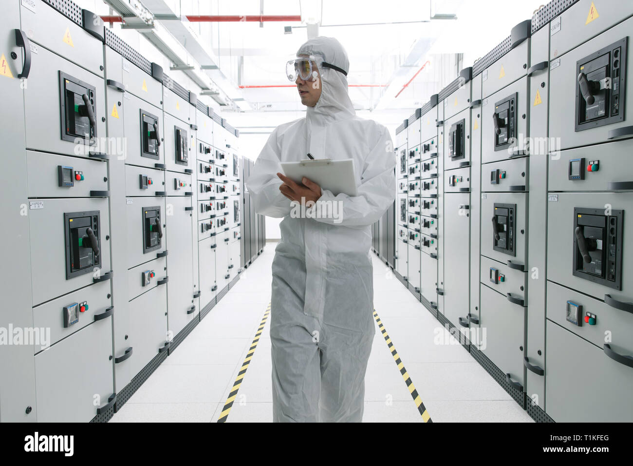 Technicians work in a factory Stock Photo - Alamy