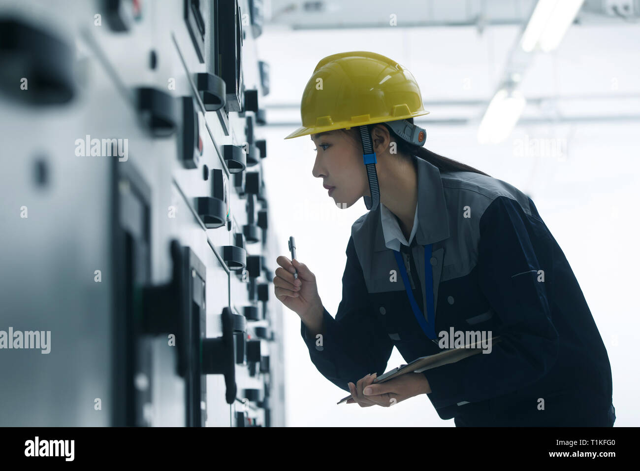 Technicians work in a factory Stock Photo - Alamy
