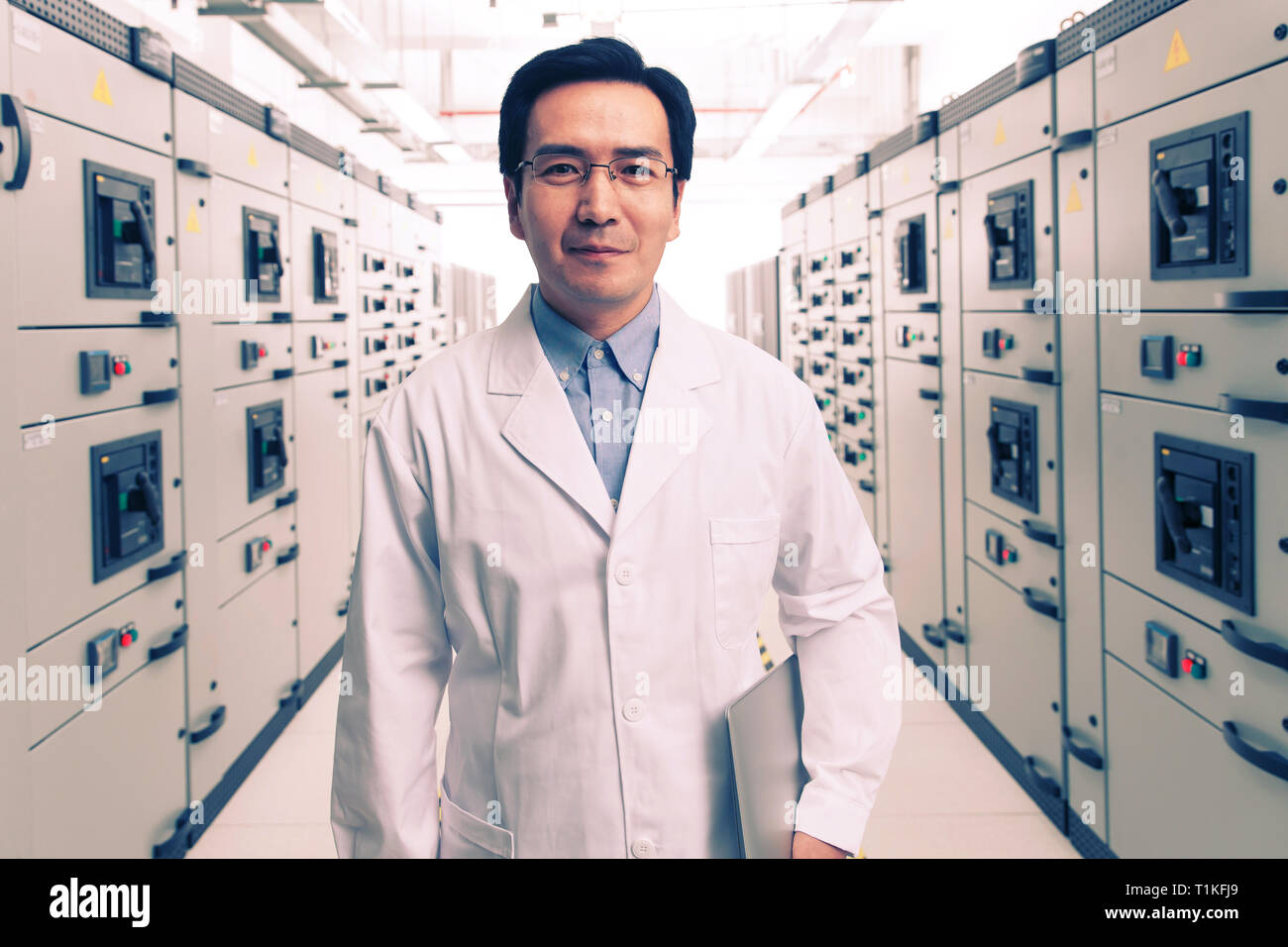 Technical personnel in the voltage room work Stock Photo - Alamy