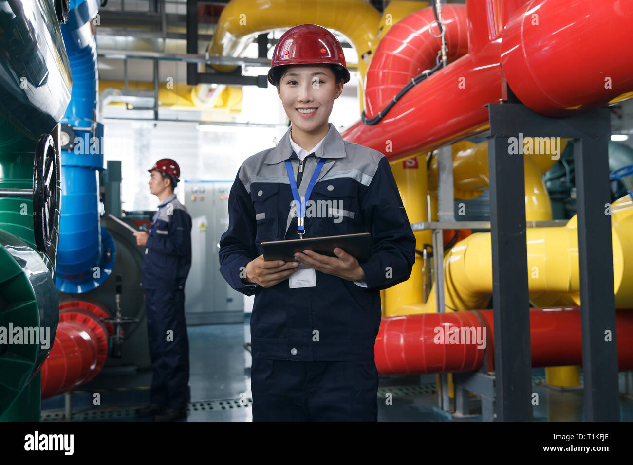 Technicians work in a factory Stock Photo - Alamy