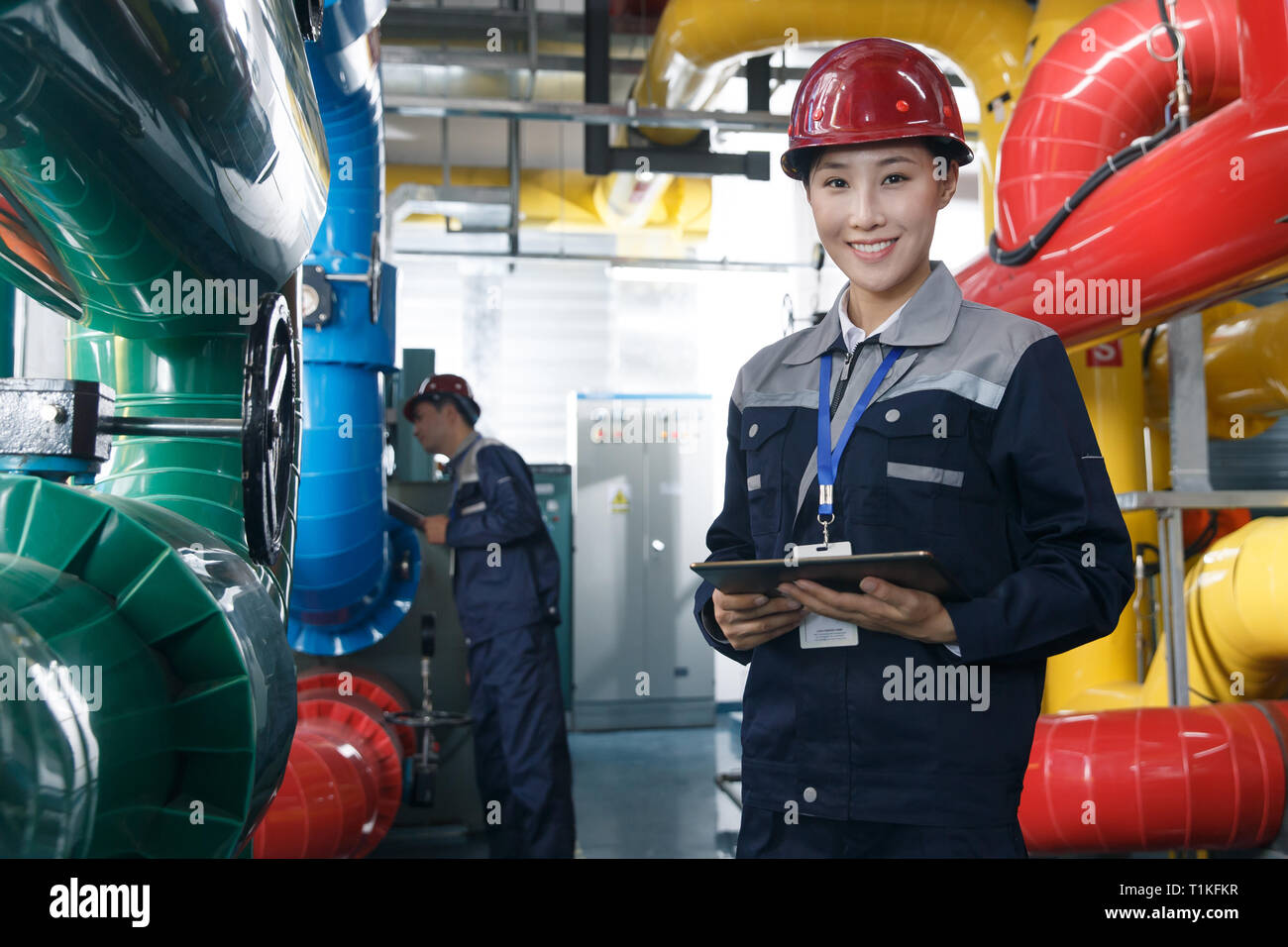 Technicians work in a factory Stock Photo - Alamy