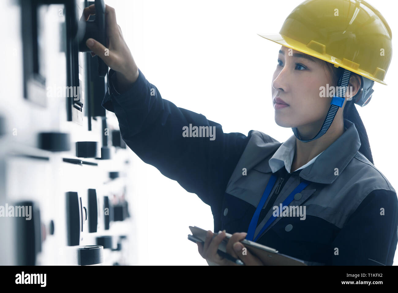 Technicians work in a factory Stock Photo - Alamy