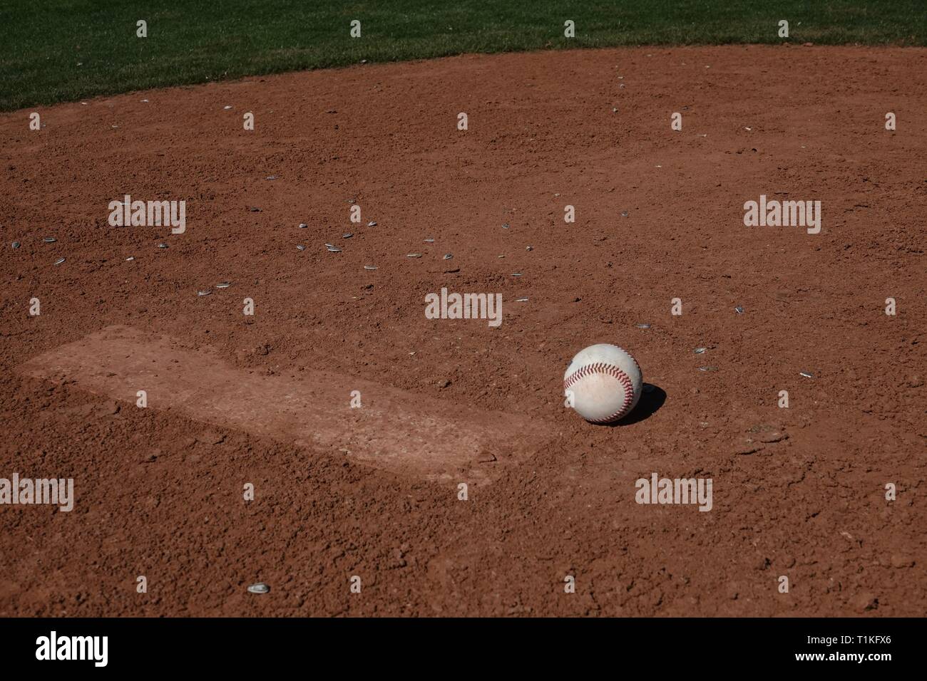 A baseball on the dirt of the pitchers mound Stock Photo - Alamy