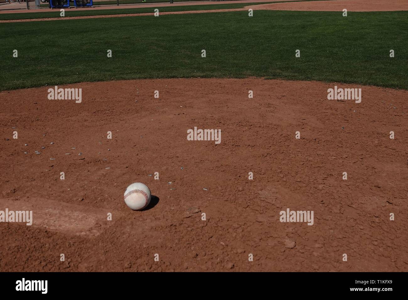 A baseball on the dirt of the pitchers mound Stock Photo - Alamy