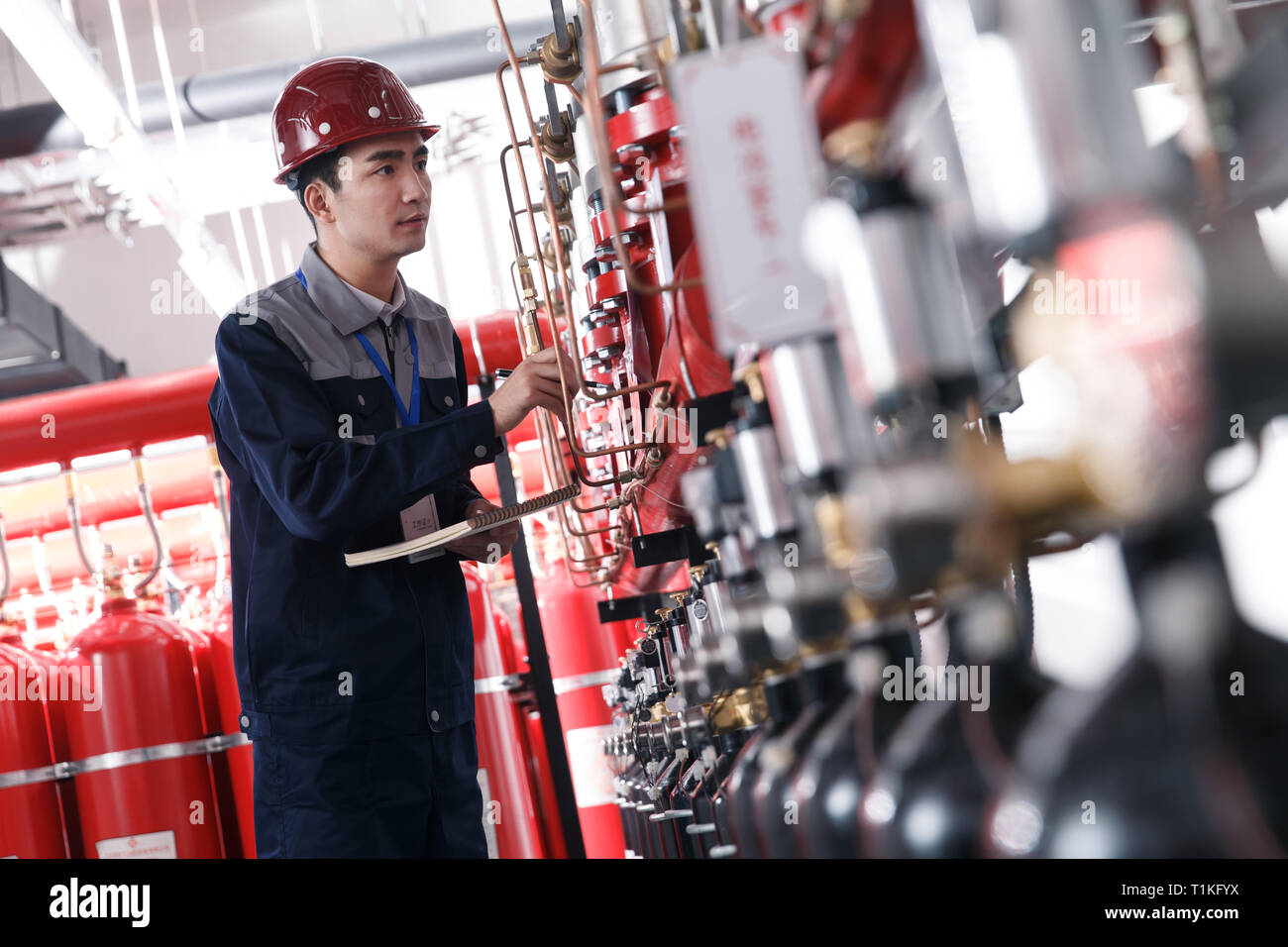 Technical personnel in the factory fire control room inspection Stock ...