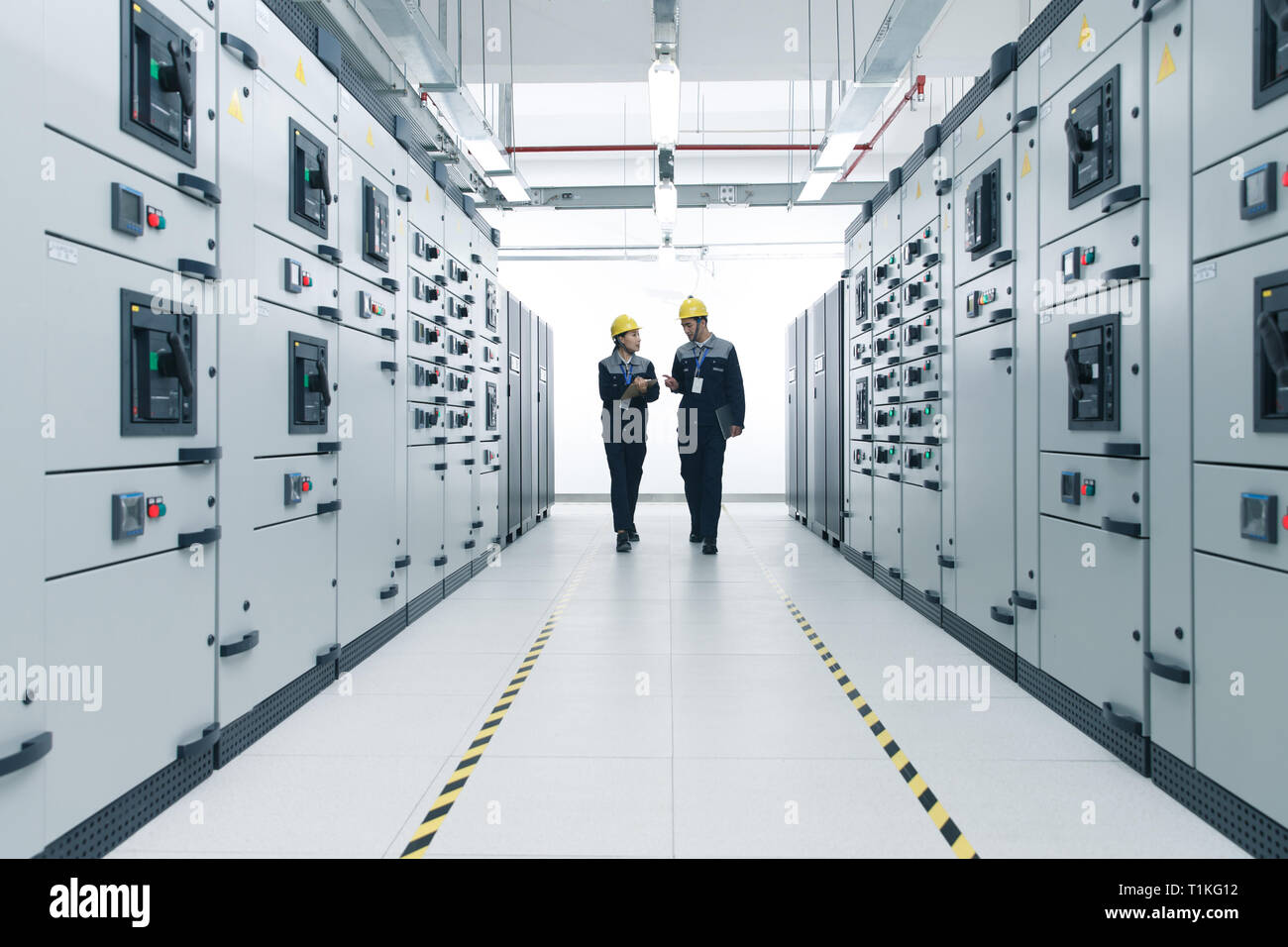 Two young technicians repairing hi-res stock photography and images - Alamy