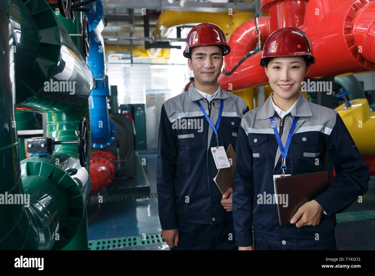 Technicians work in a factory Stock Photo - Alamy