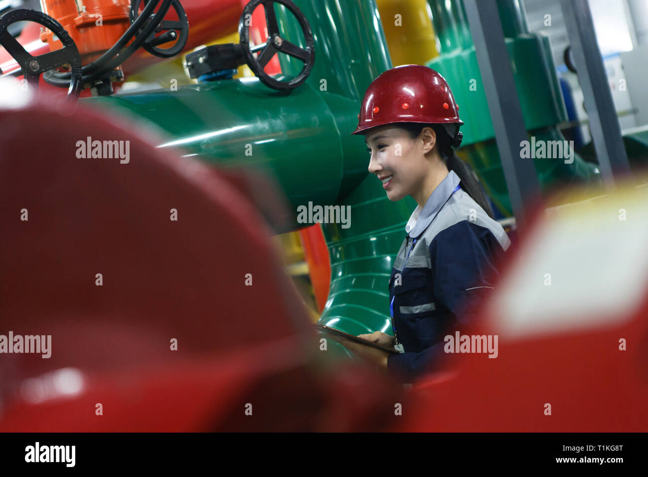Technicians work in a factory Stock Photo - Alamy