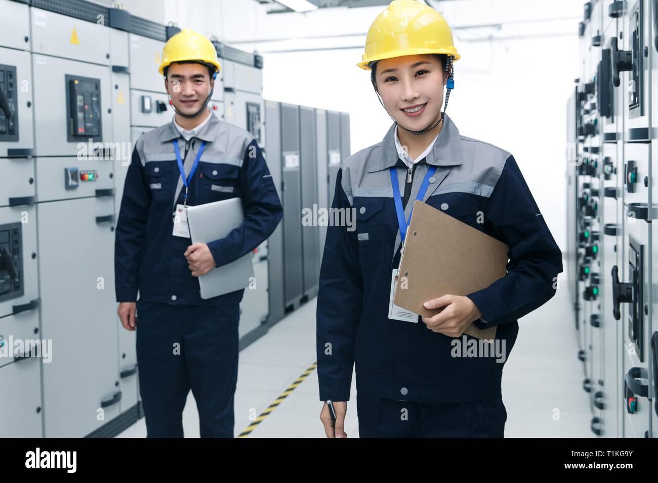 Two young technicians repairing hi-res stock photography and images - Alamy
