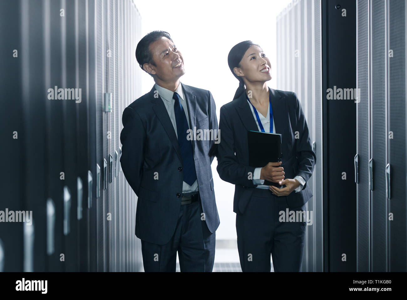 Technical personnel in machine room inspection Stock Photo - Alamy