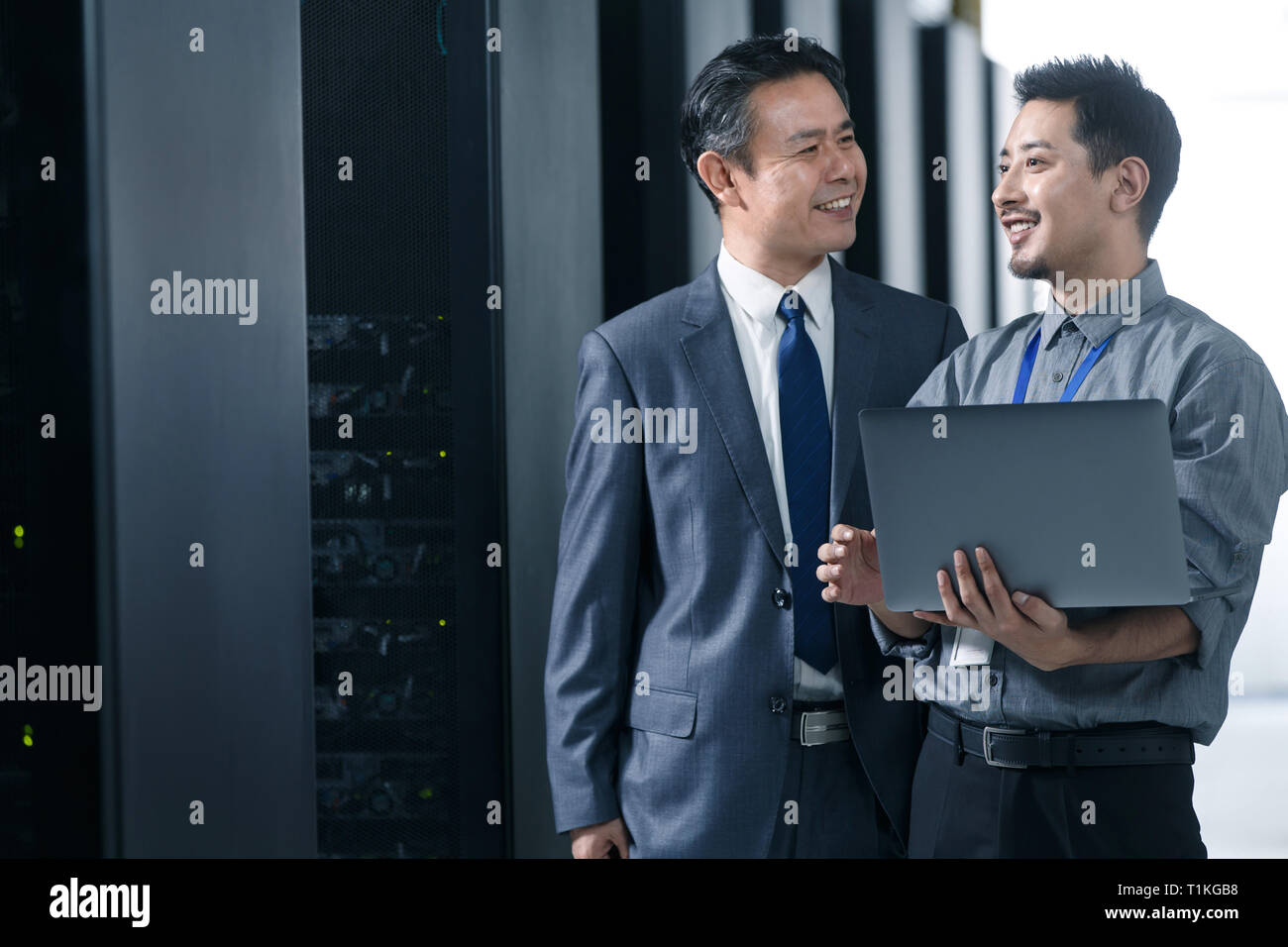 Technical personnel in machine room inspection Stock Photo - Alamy
