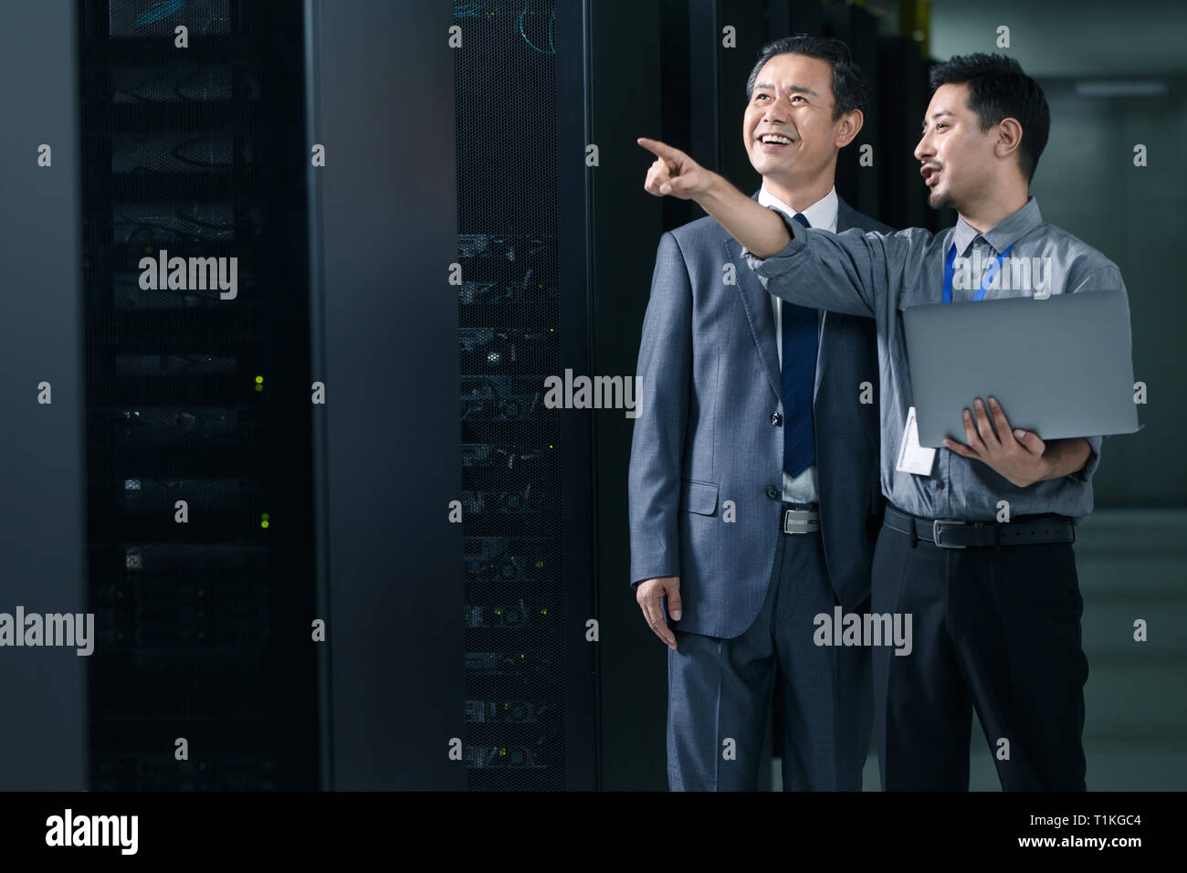 Technical personnel in machine room inspection Stock Photo - Alamy