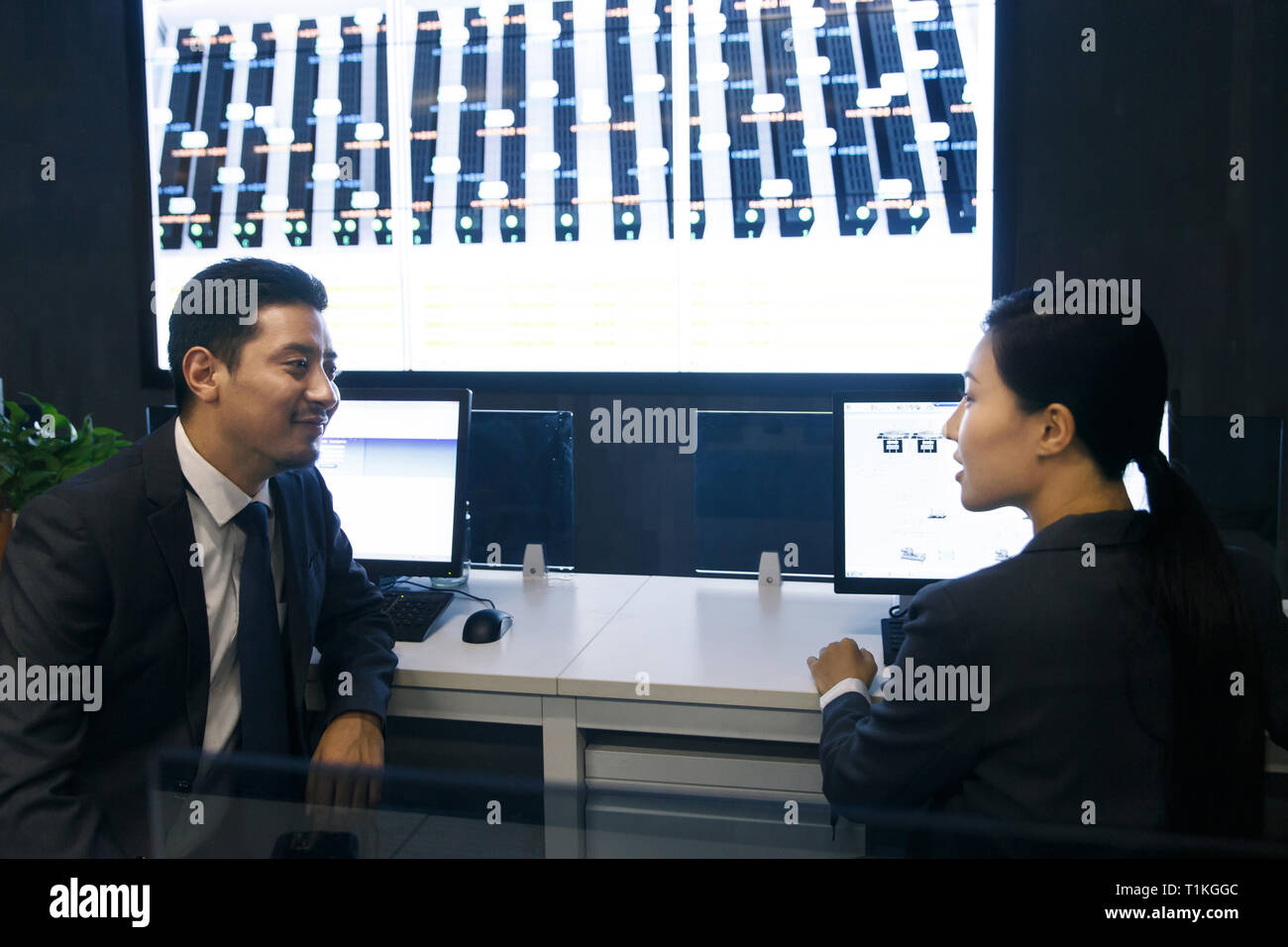 Business people in the control room Stock Photo - Alamy