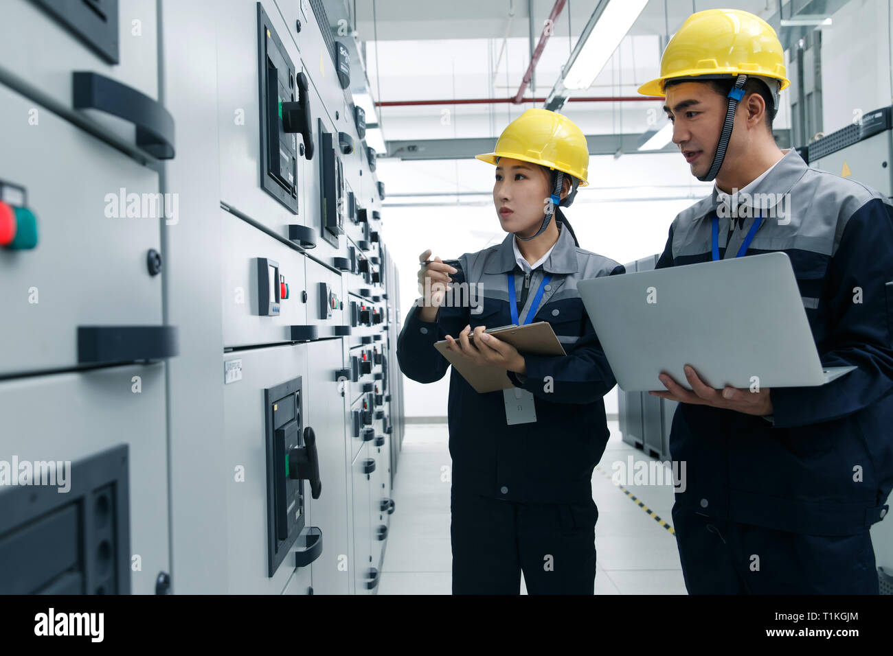 Technicians work in a factory Stock Photo - Alamy