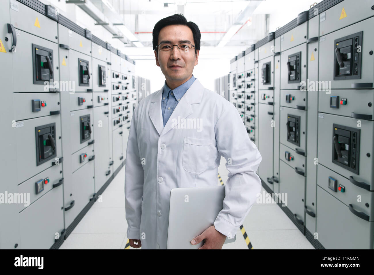 Technical personnel in the voltage room work Stock Photo - Alamy