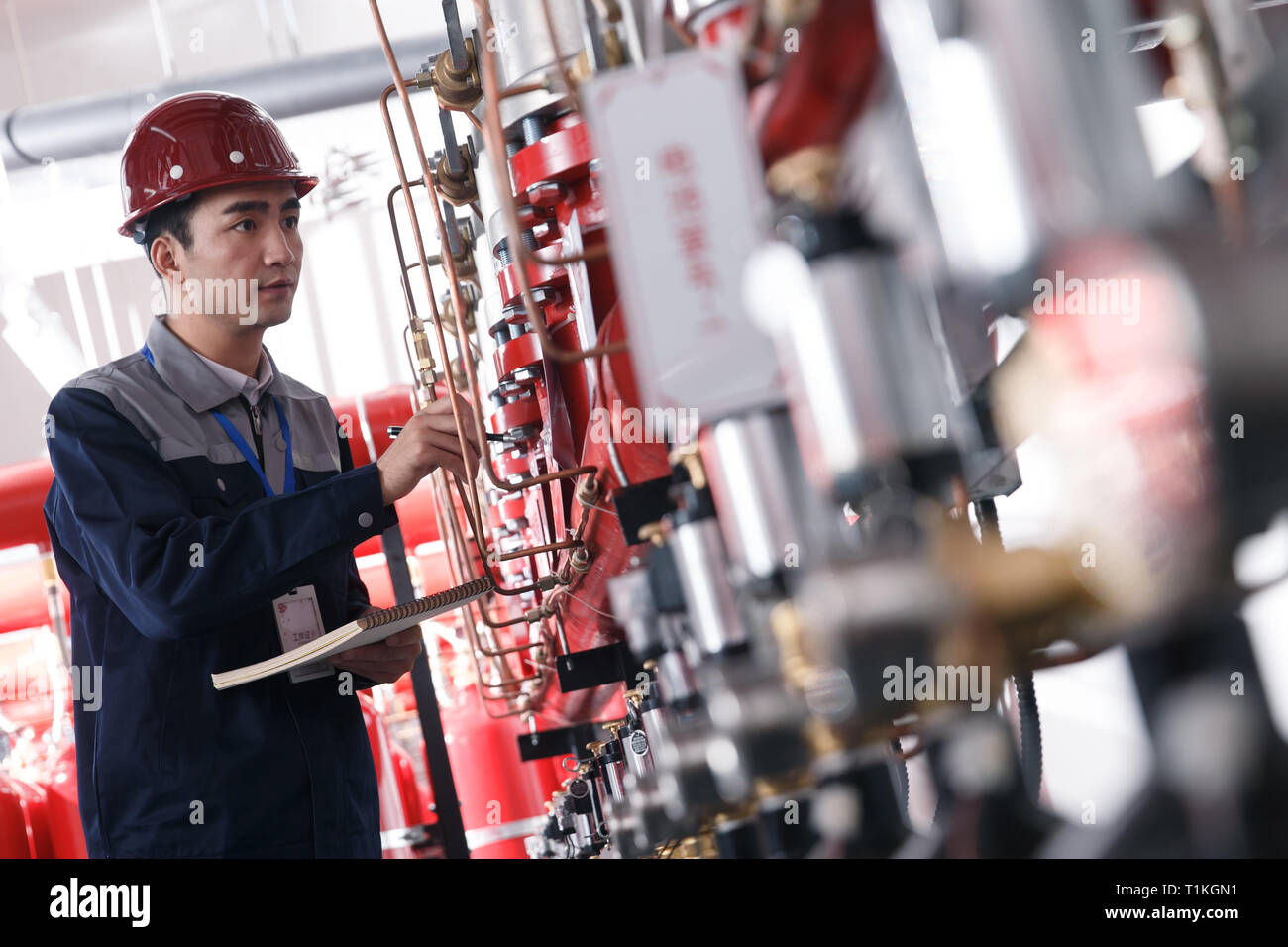 Technical personnel in the factory fire control room inspection Stock ...