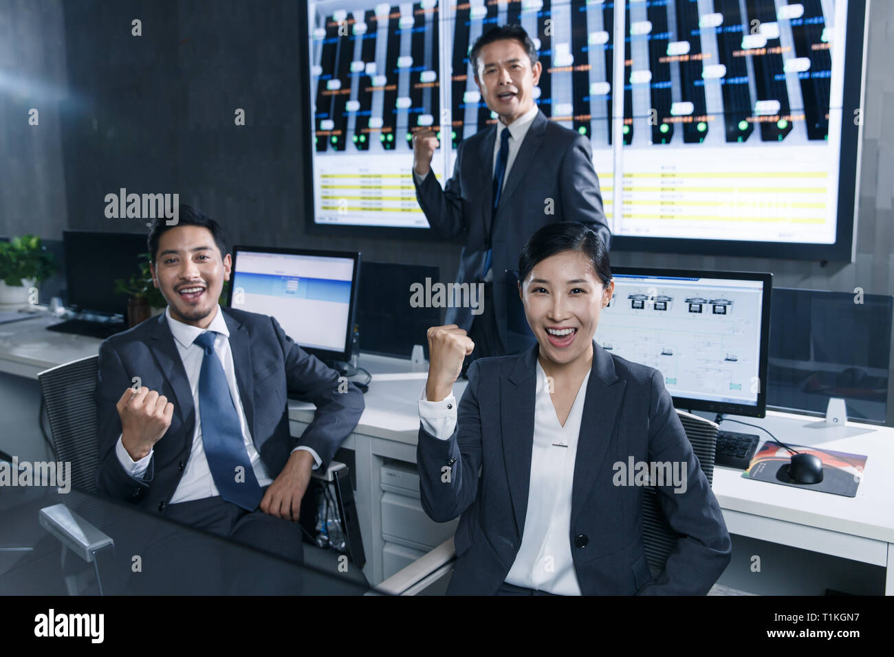 Business people in the control room Stock Photo - Alamy