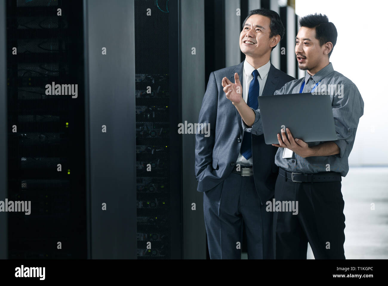 Technical personnel in machine room inspection Stock Photo - Alamy