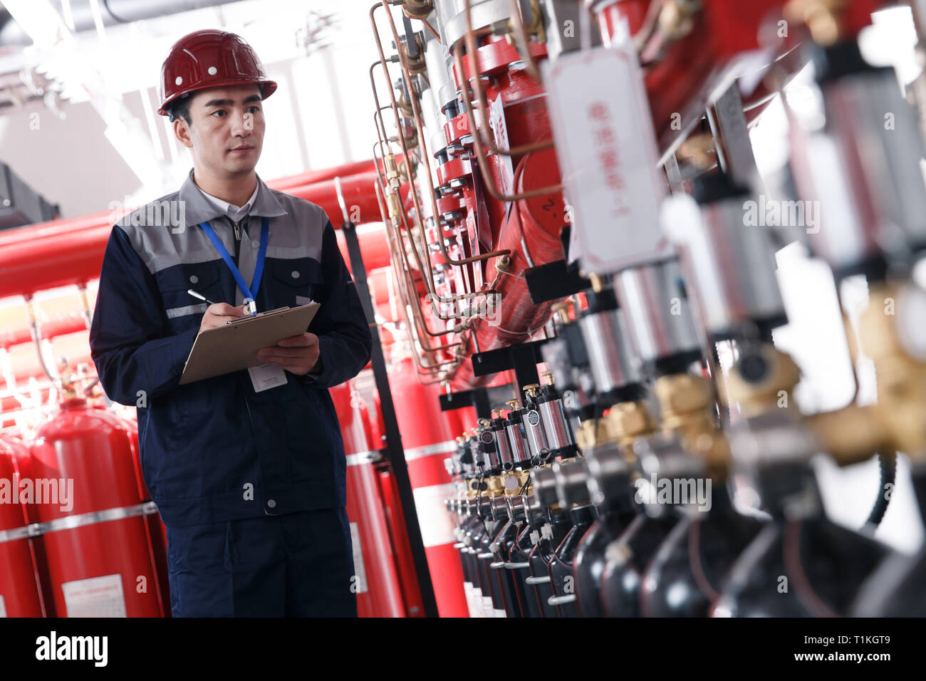 Technical personnel in the factory fire control room inspection Stock ...