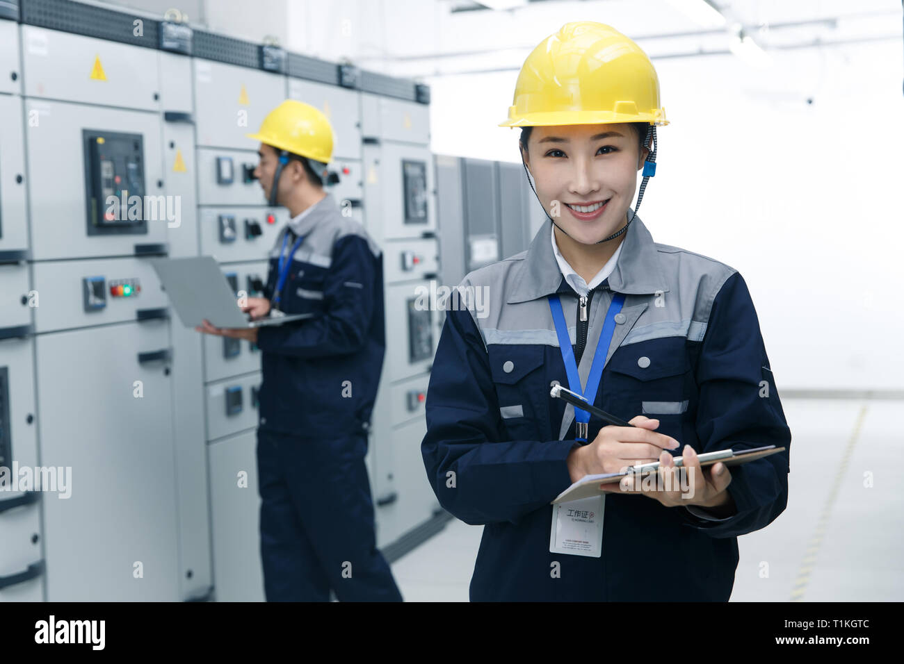 Technicians work in a factory Stock Photo - Alamy