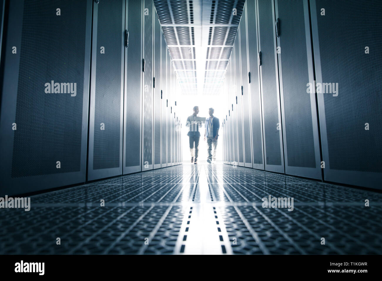 Technical personnel in machine room inspection Stock Photo - Alamy