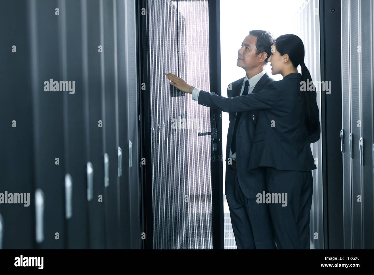Technical personnel in machine room inspection Stock Photo - Alamy