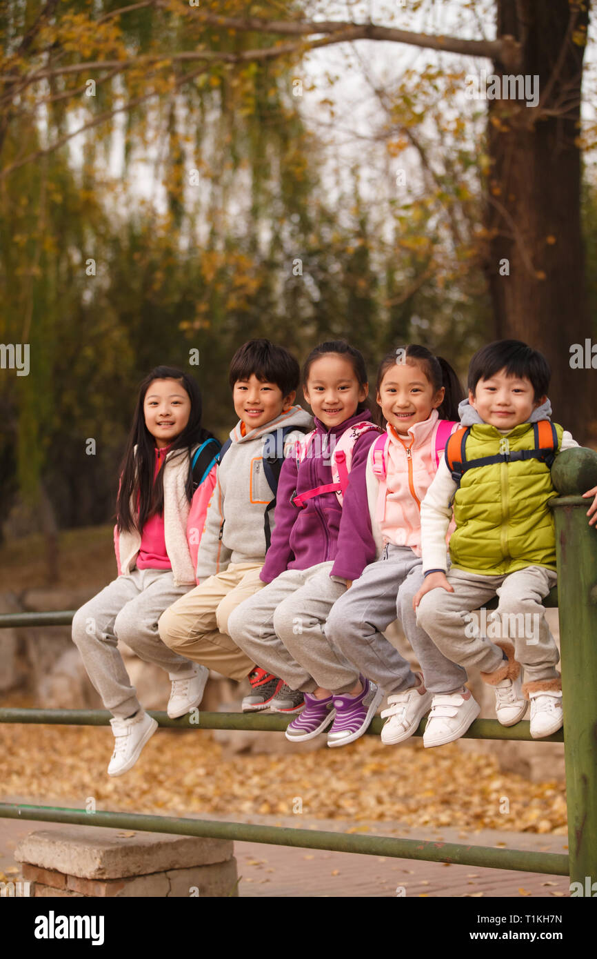 Pupils play outdoors Stock Photo - Alamy