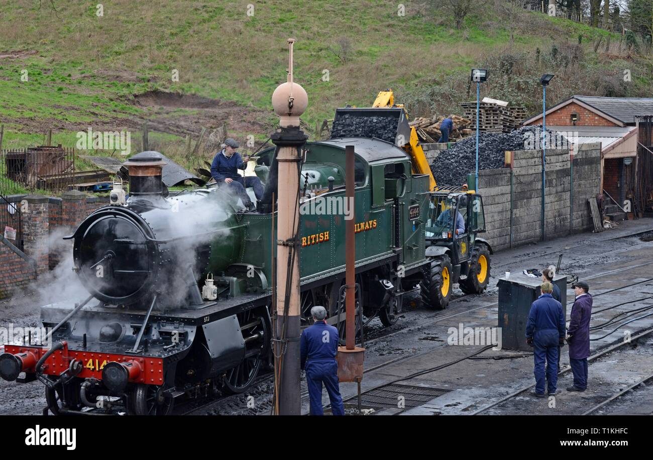 Great Western Railway steam locomotive 4144 is filled with coal & water ...