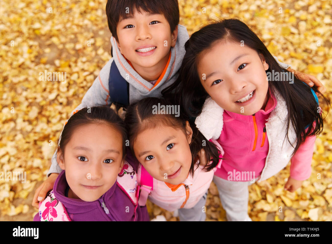 Pupils play outdoors Stock Photo - Alamy