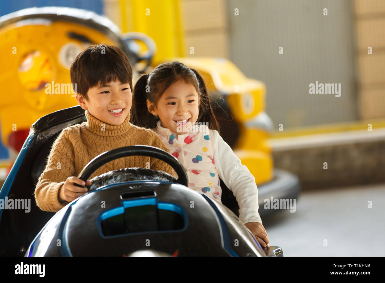 Elementary school students play in the playground Stock Photo - Alamy