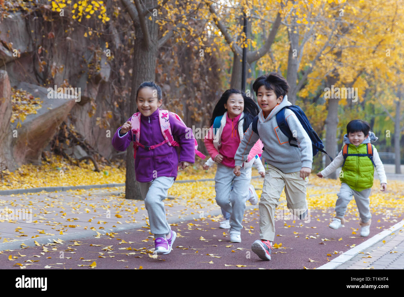 The joy of primary school children running in outdoor Stock Photo - Alamy