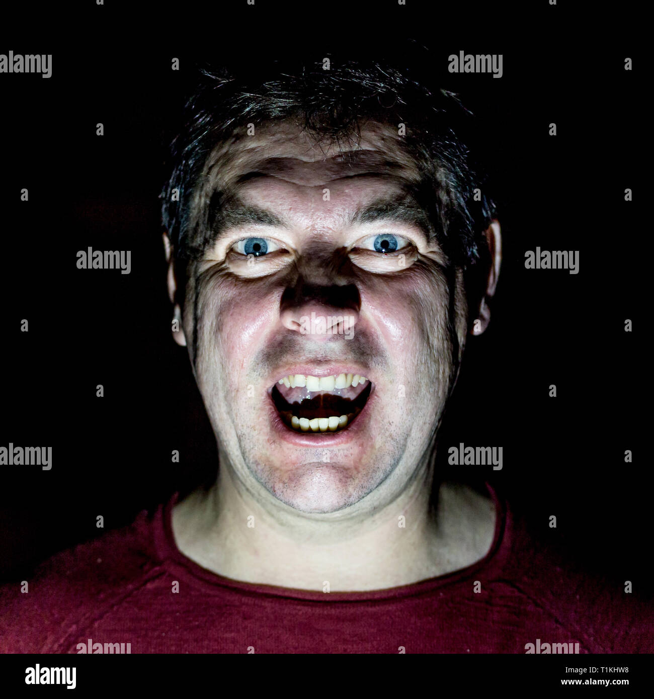 Stylish portrait of adult caucasian man. He smiles like maniac and ...