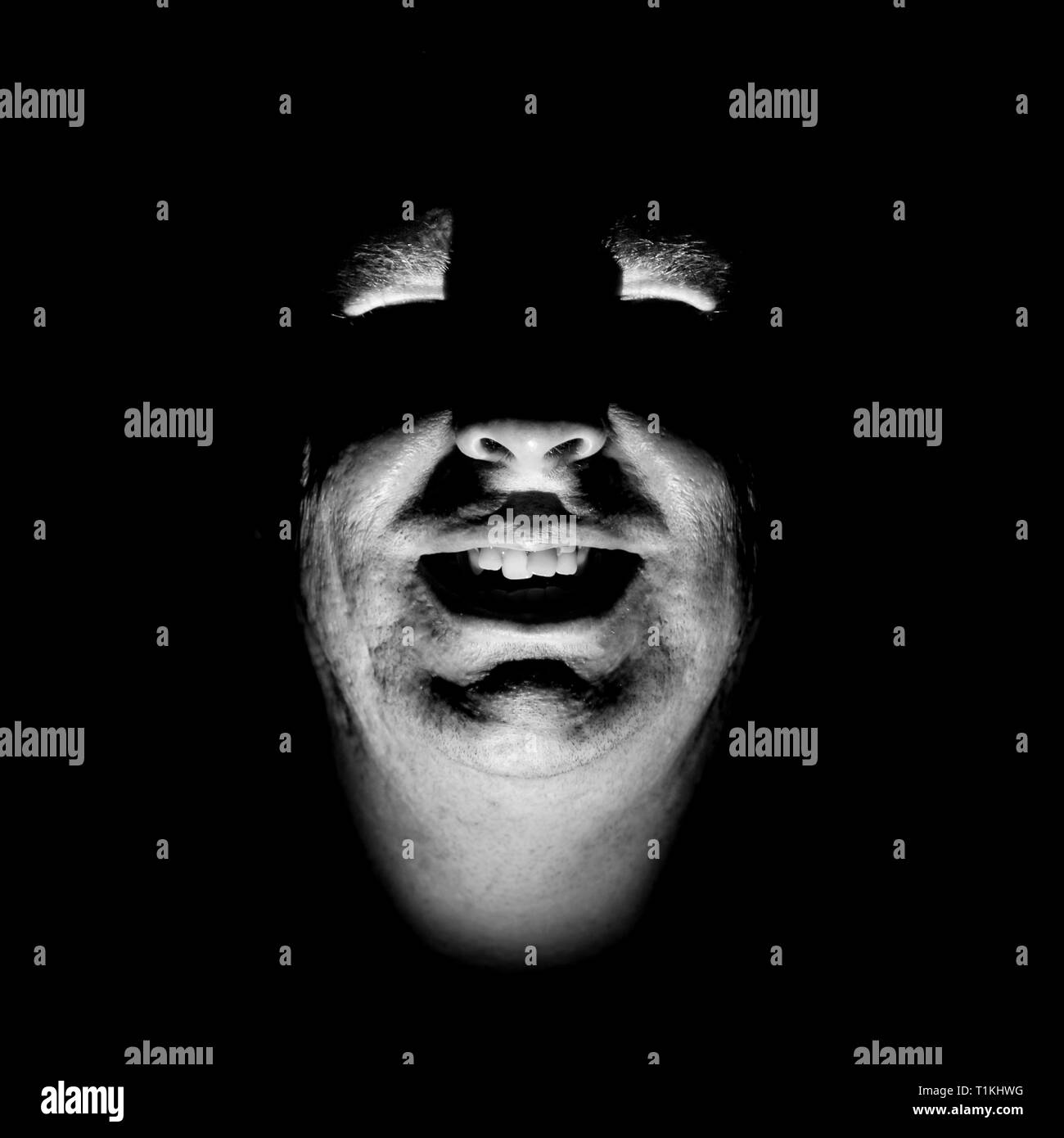 Stylish portrait of adult caucasian man. He smiles like maniac and ...