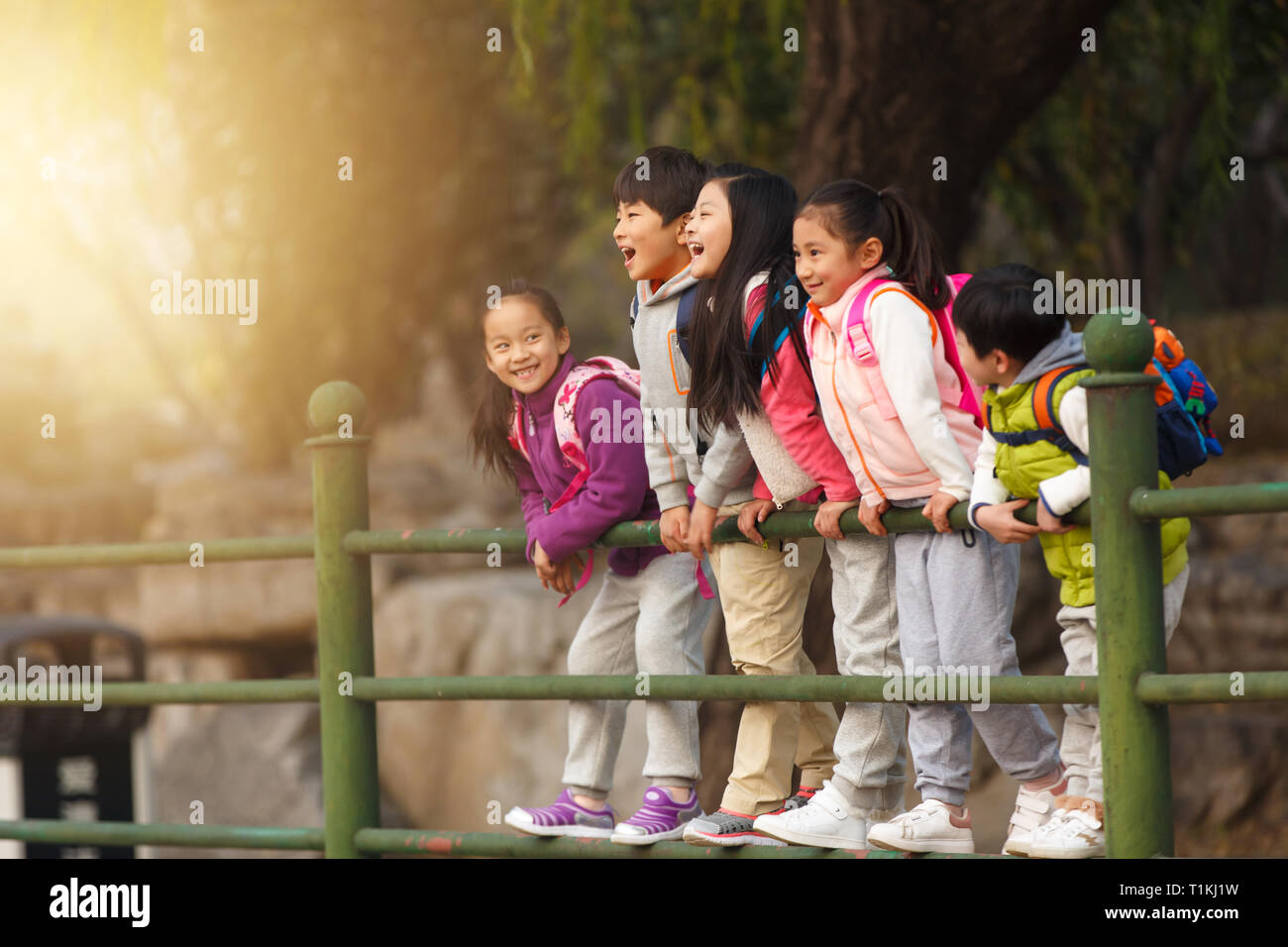 Pupils play outdoors Stock Photo - Alamy