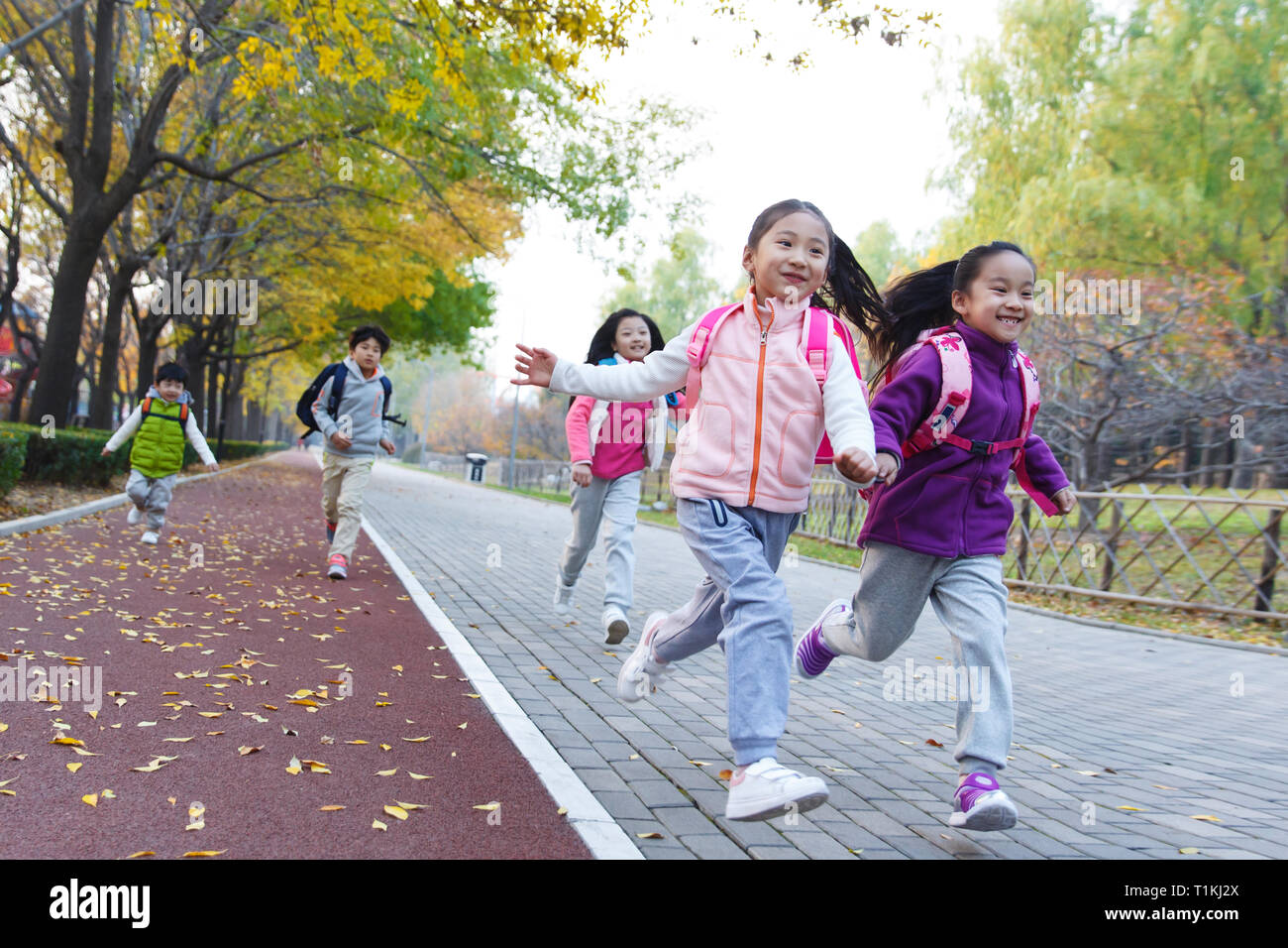 The joy of primary school children running in outdoor Stock Photo - Alamy