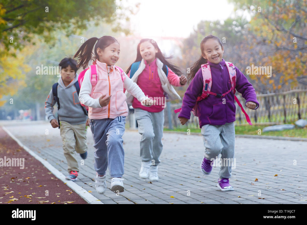 Primary school children running in hi-res stock photography and images ...
