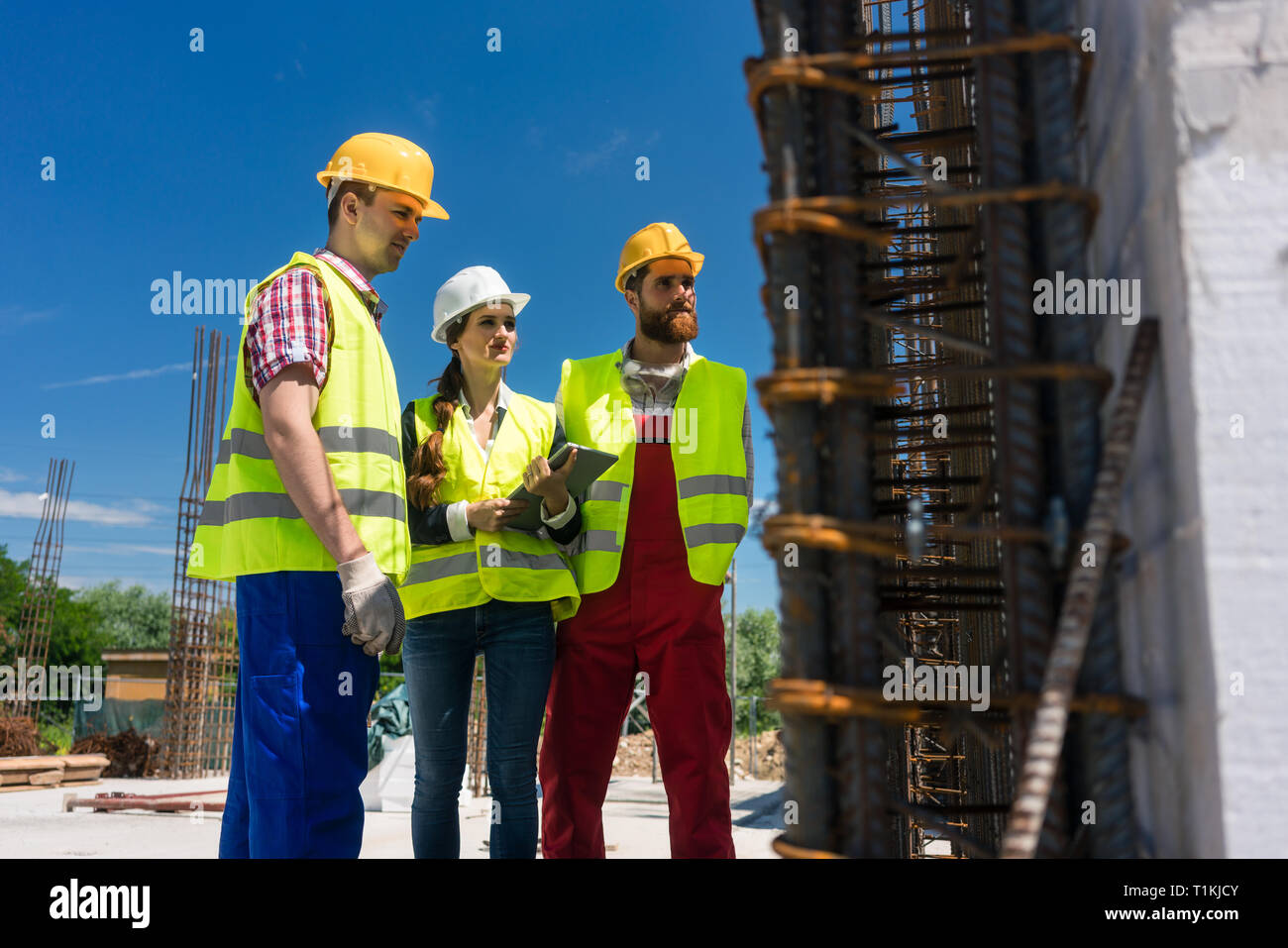 Architect supervising work on the construction site of a building Stock ...