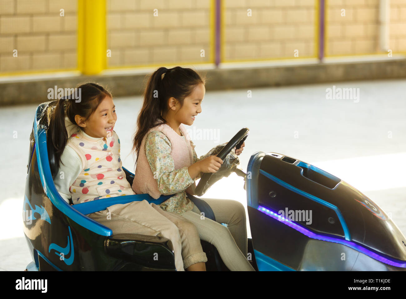 Elementary school students play in the playground Stock Photo - Alamy