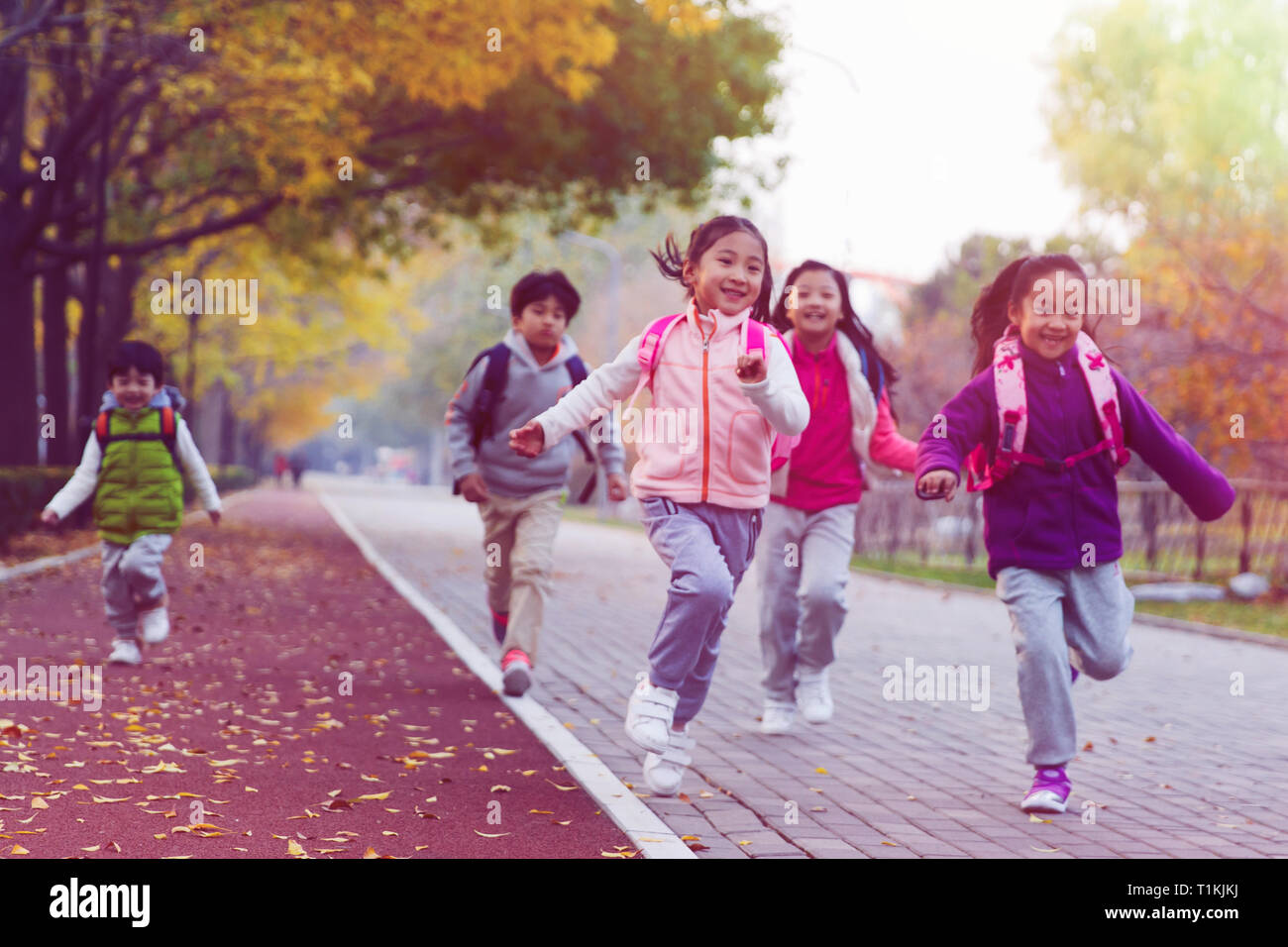 Primary school children running in hi-res stock photography and images ...