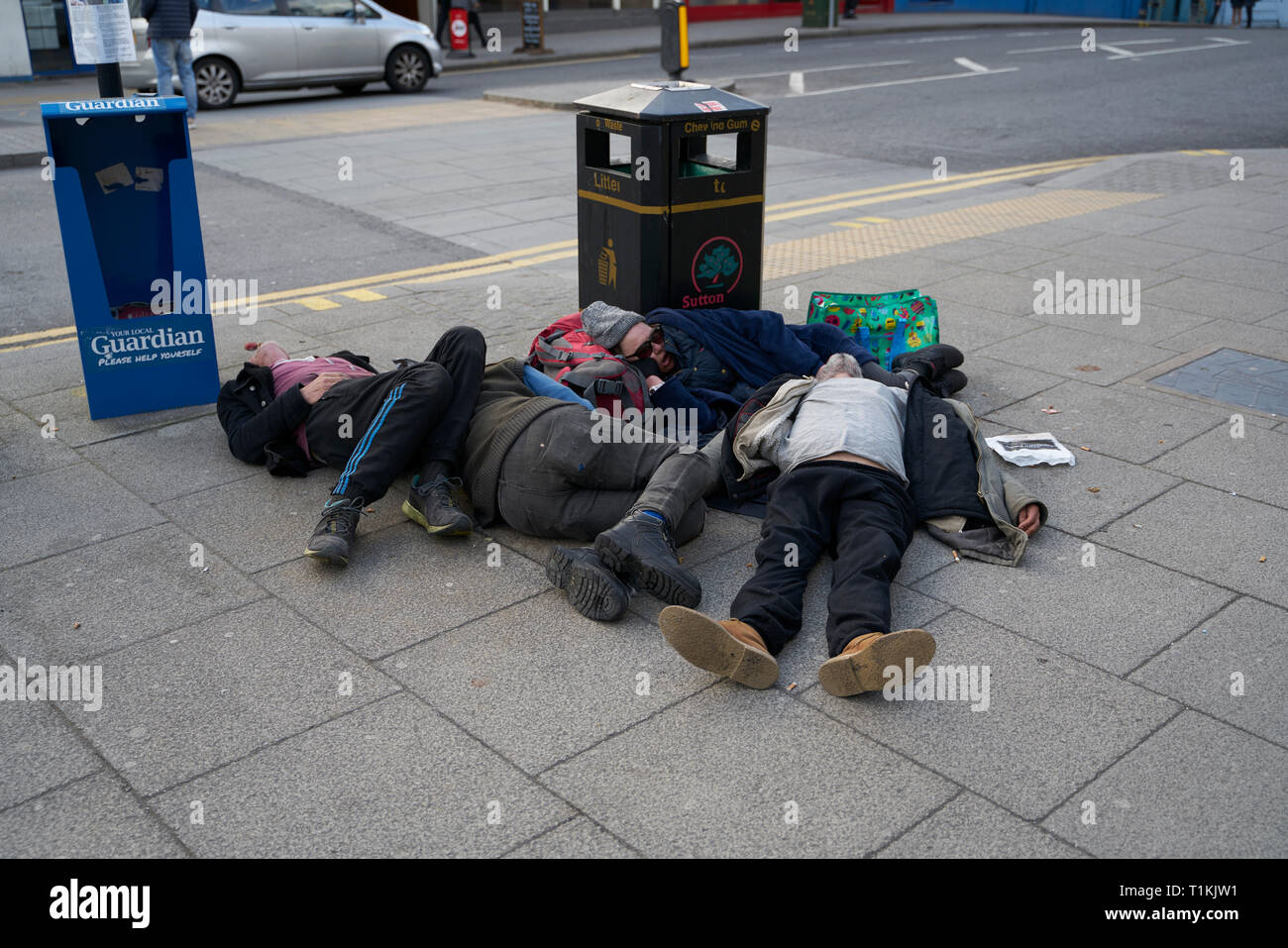 Homeless People Sleeping on Street Stock Photo - Alamy