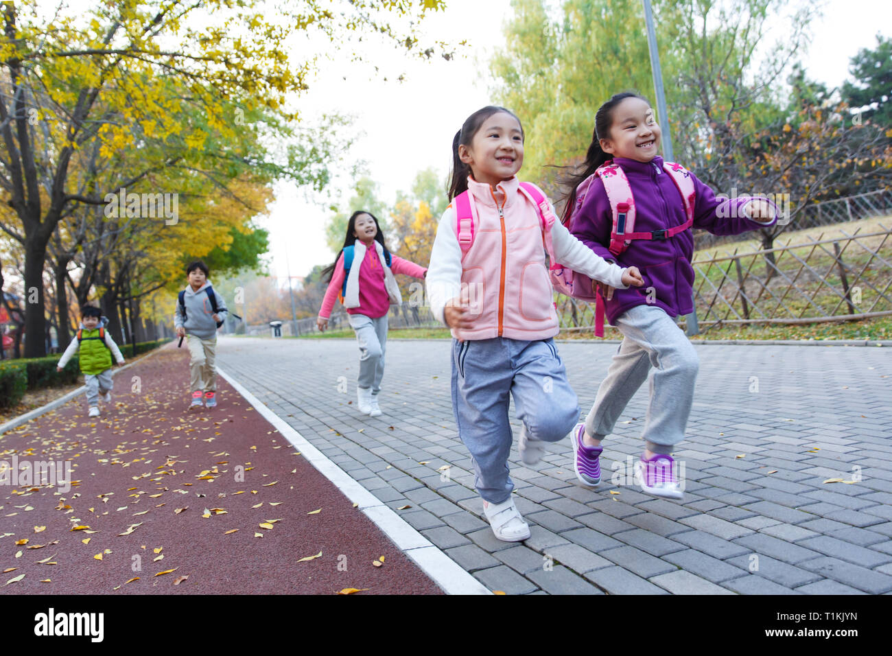Primary school children running in hi-res stock photography and images ...
