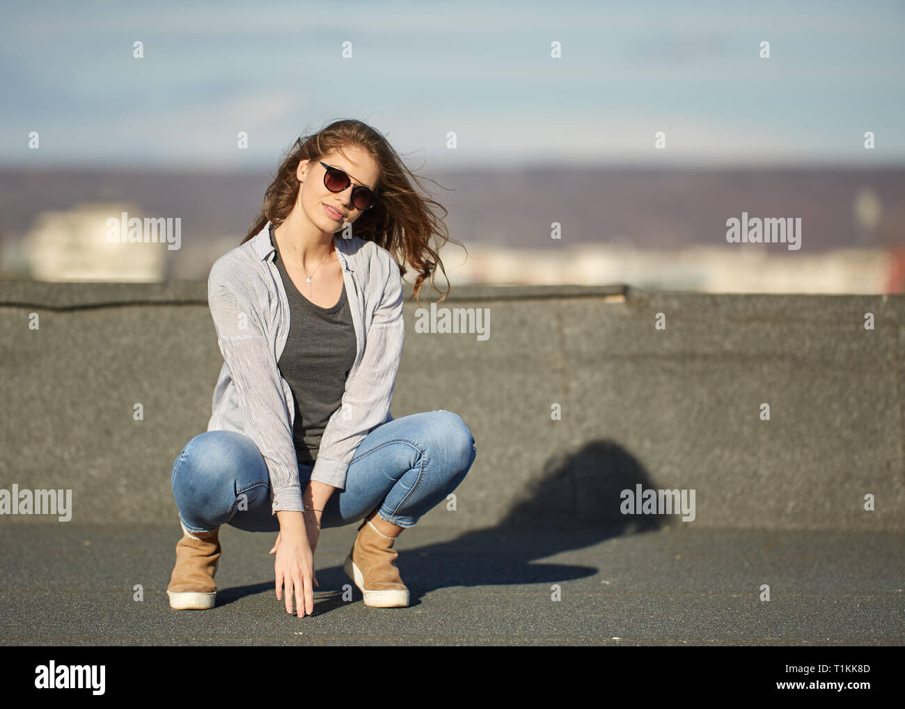 Shallow DOF portrait of a beautiful woman in urban environment Stock ...