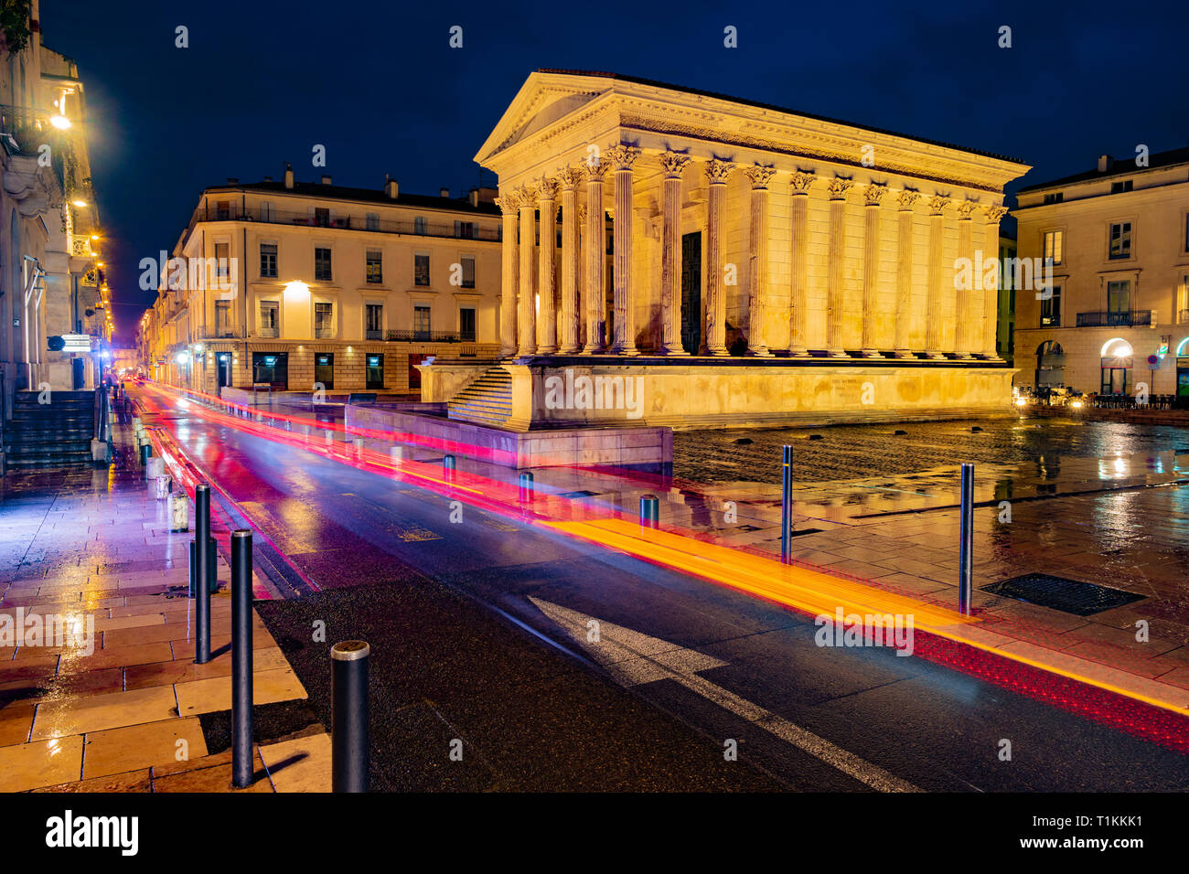 Maison Carree, ancient Roman temple in night lights, Nimes, France ...