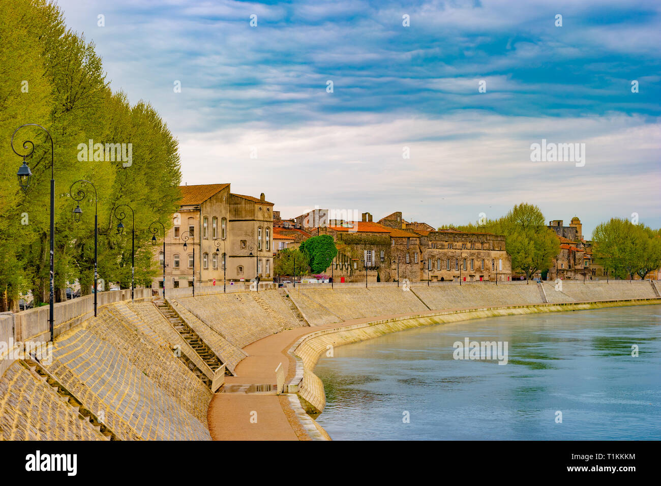 The river Rhone at Arles overlooking the old town. Buches du Rhone ...