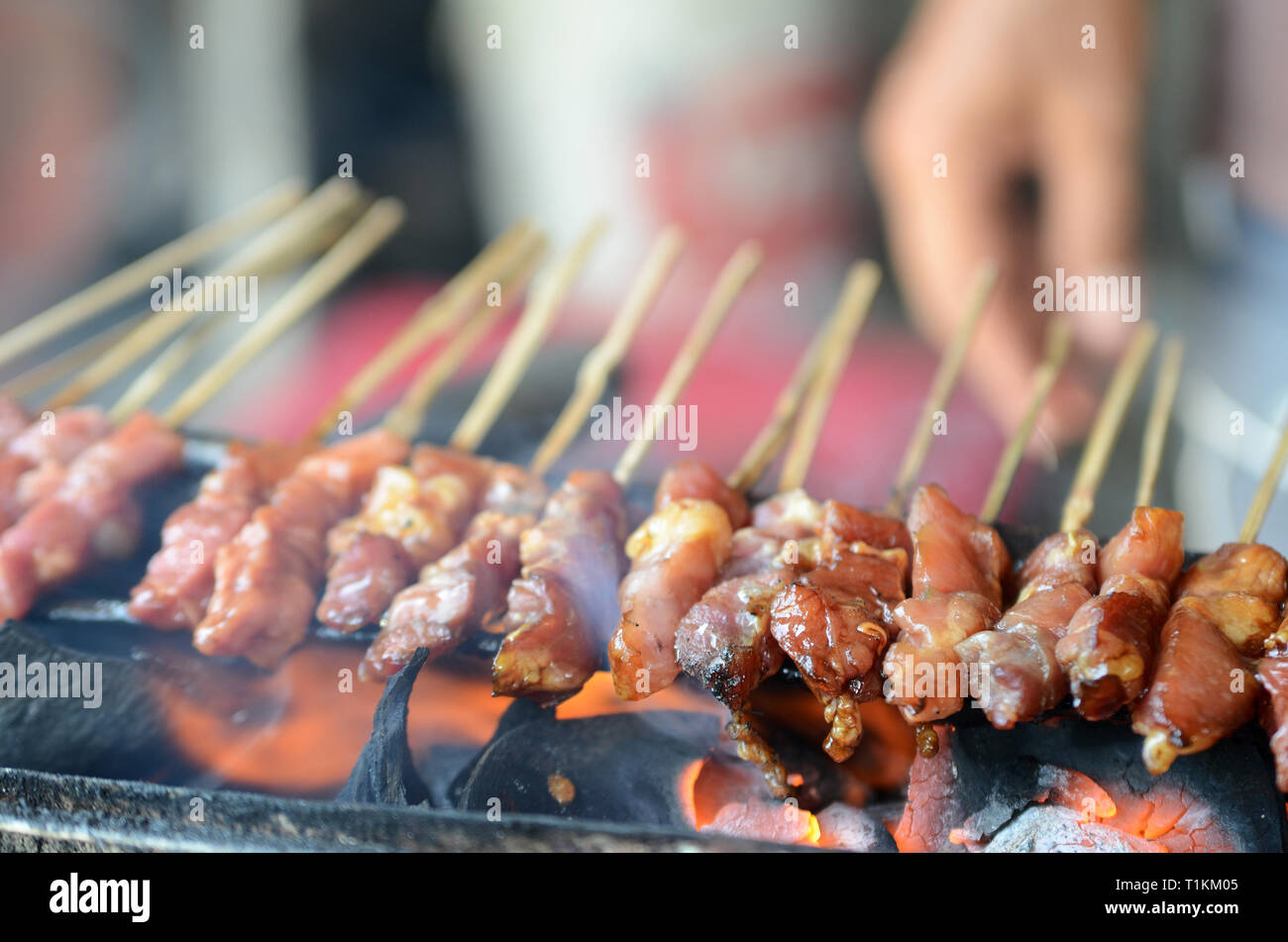 Indonesian grilled bbq meats in wooden skewers Stock Photo - Alamy