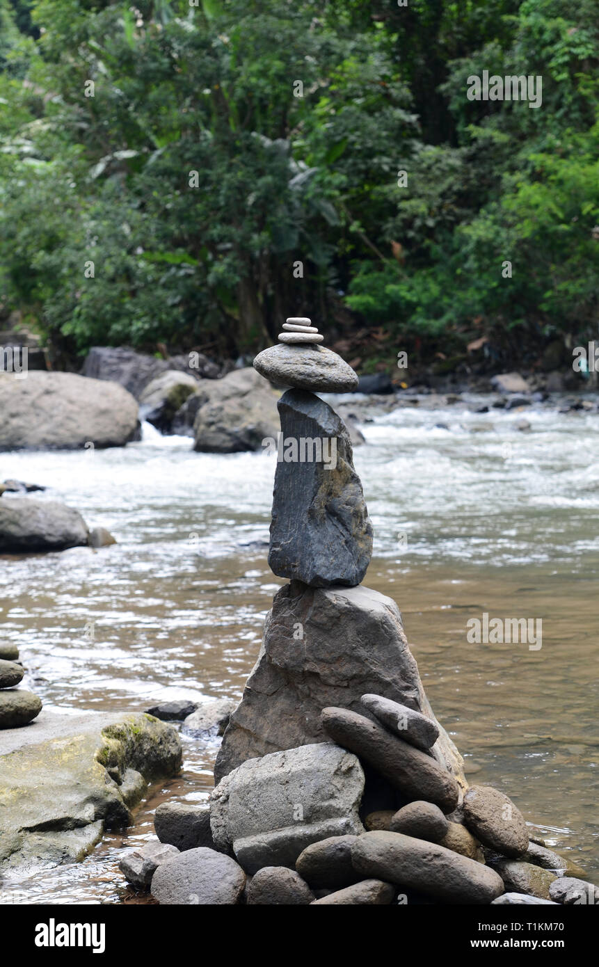 Stacked zen stone at Tegenungan Waterfall in Ubud Bali Indonesia Stock ...