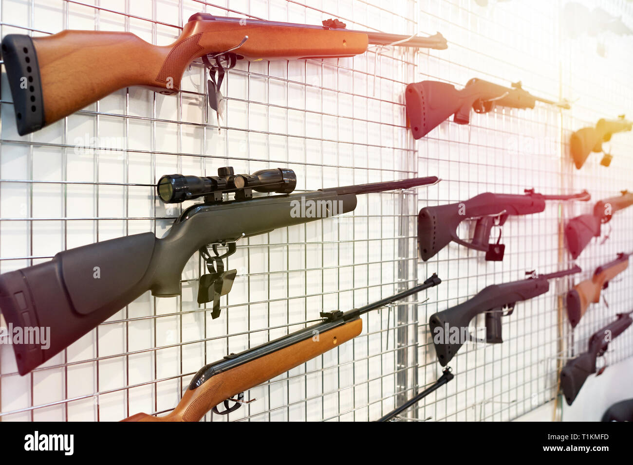 Air guns to stand in the window of the shop Stock Photo - Alamy