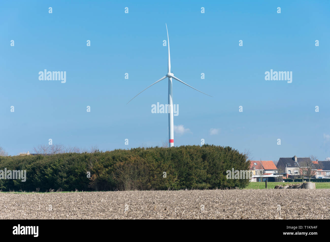Side view of a windmill with beautiful blue background Stock Photo - Alamy