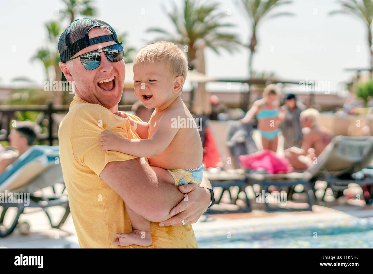 Father and son at swimming pool hi-res stock photography and images - Alamy