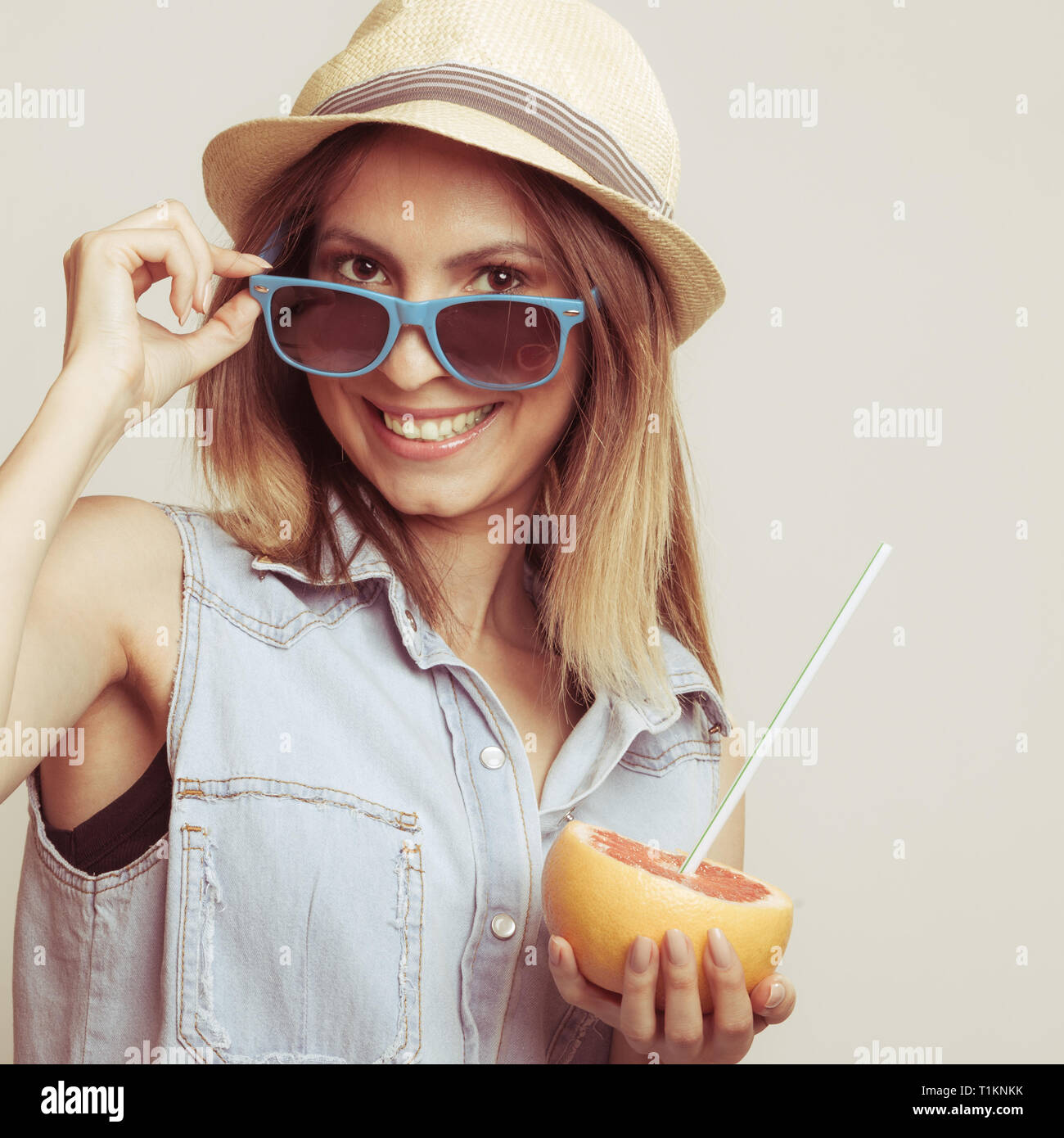 Happy glad woman tourist wearing straw hat and sunglasses holding ...